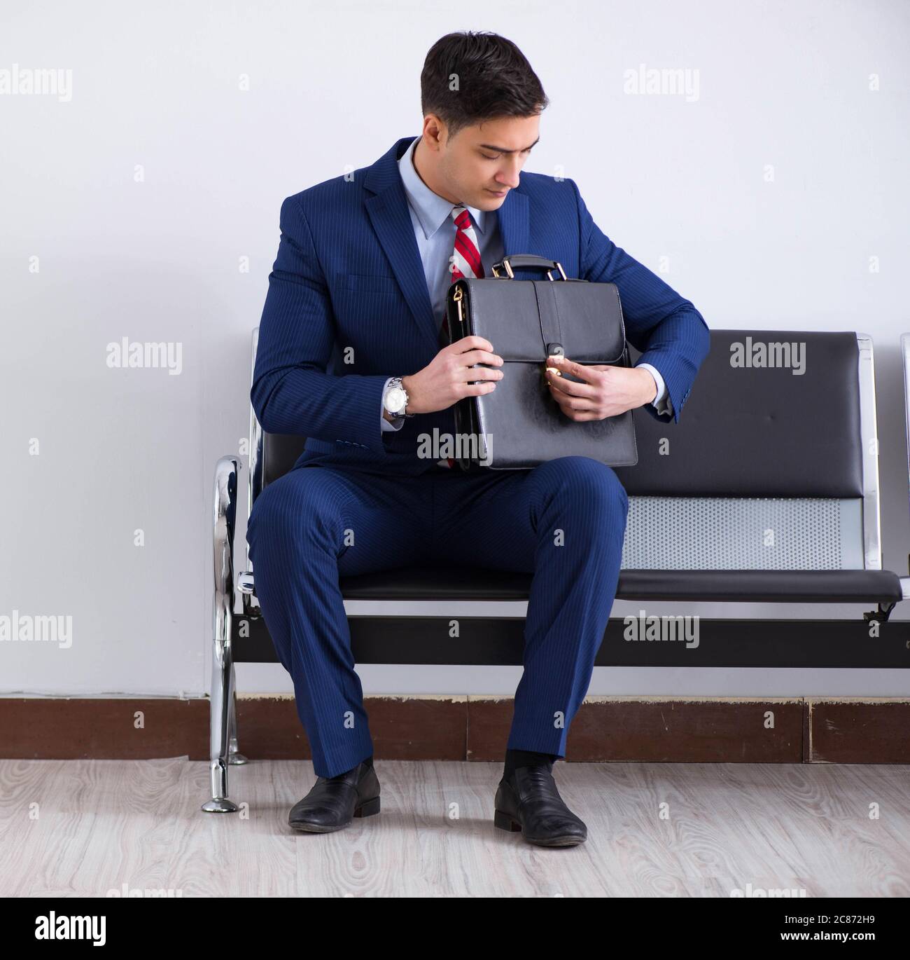 The man wairing to boarding in airport lounge room Stock Photo - Alamy