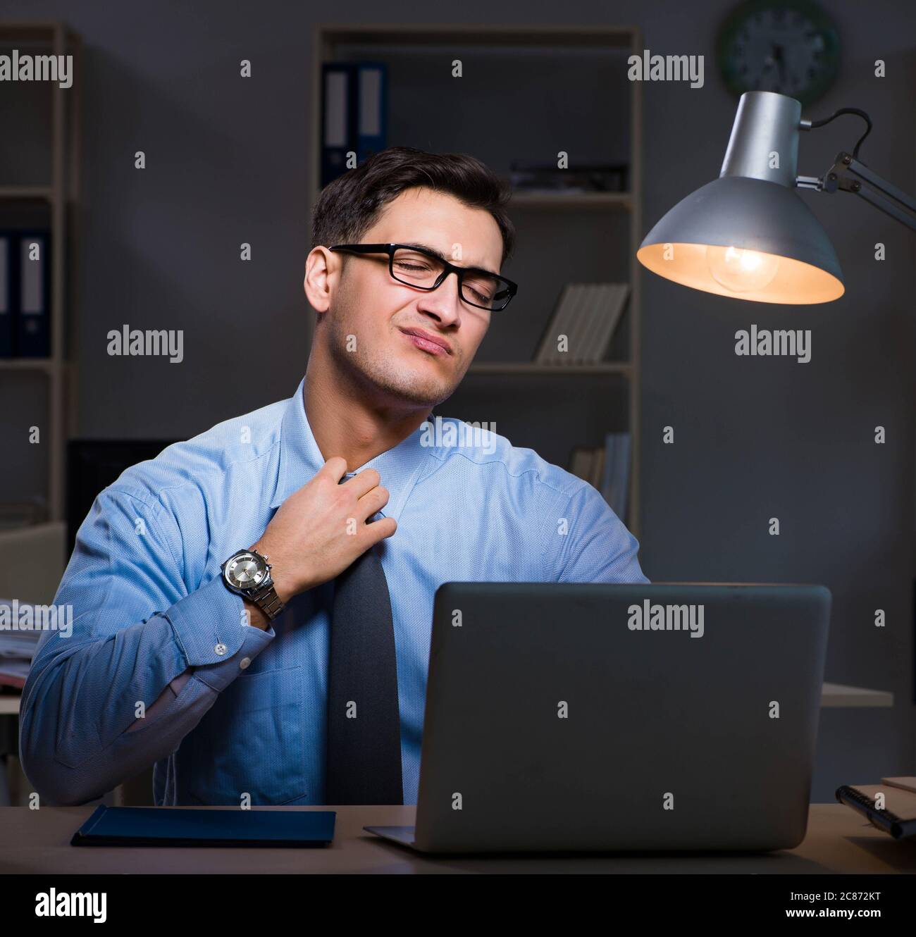 The employee working late at night at important report Stock Photo - Alamy