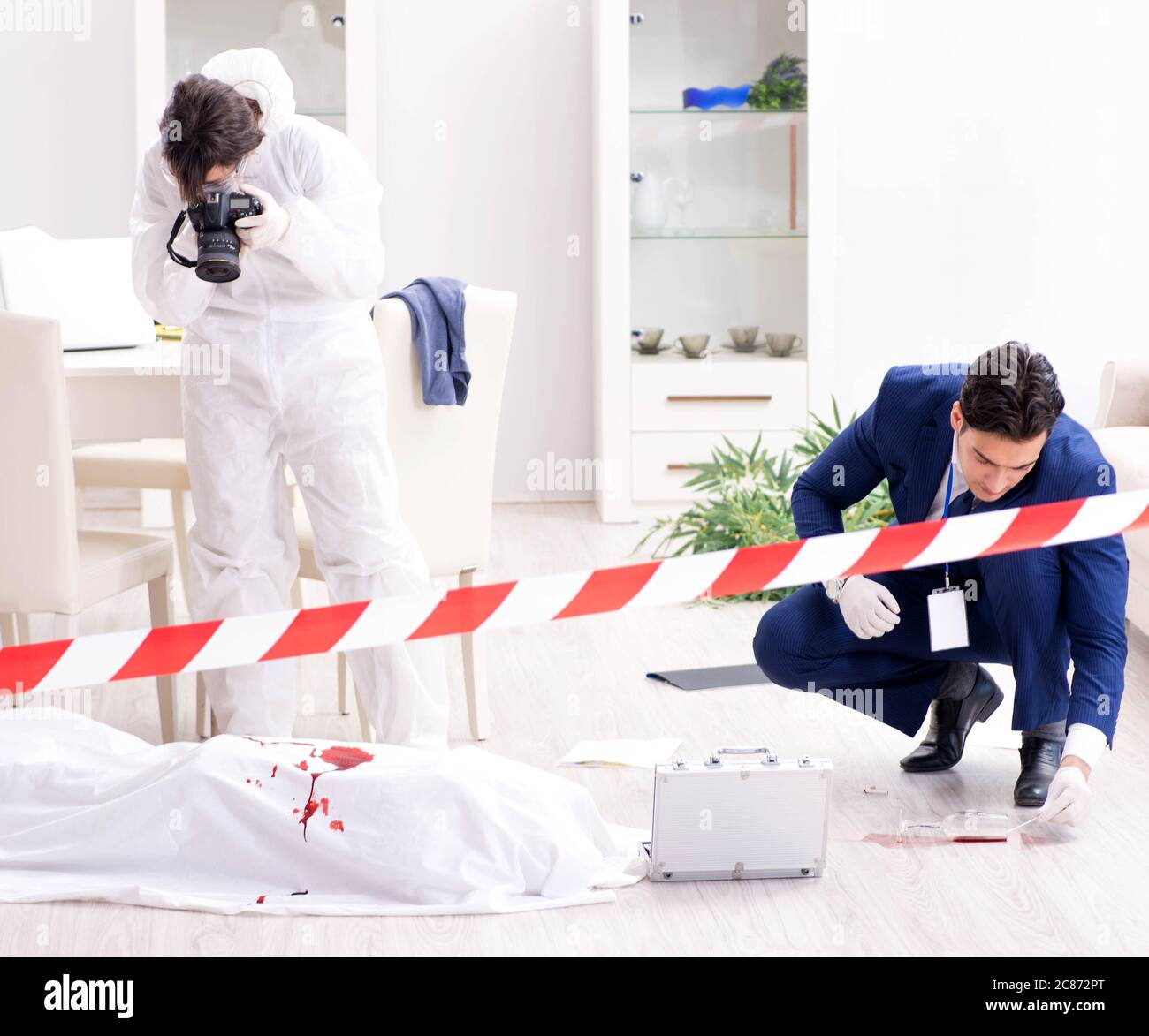 The forensics investigator at the scene of office crime Stock Photo - Alamy
