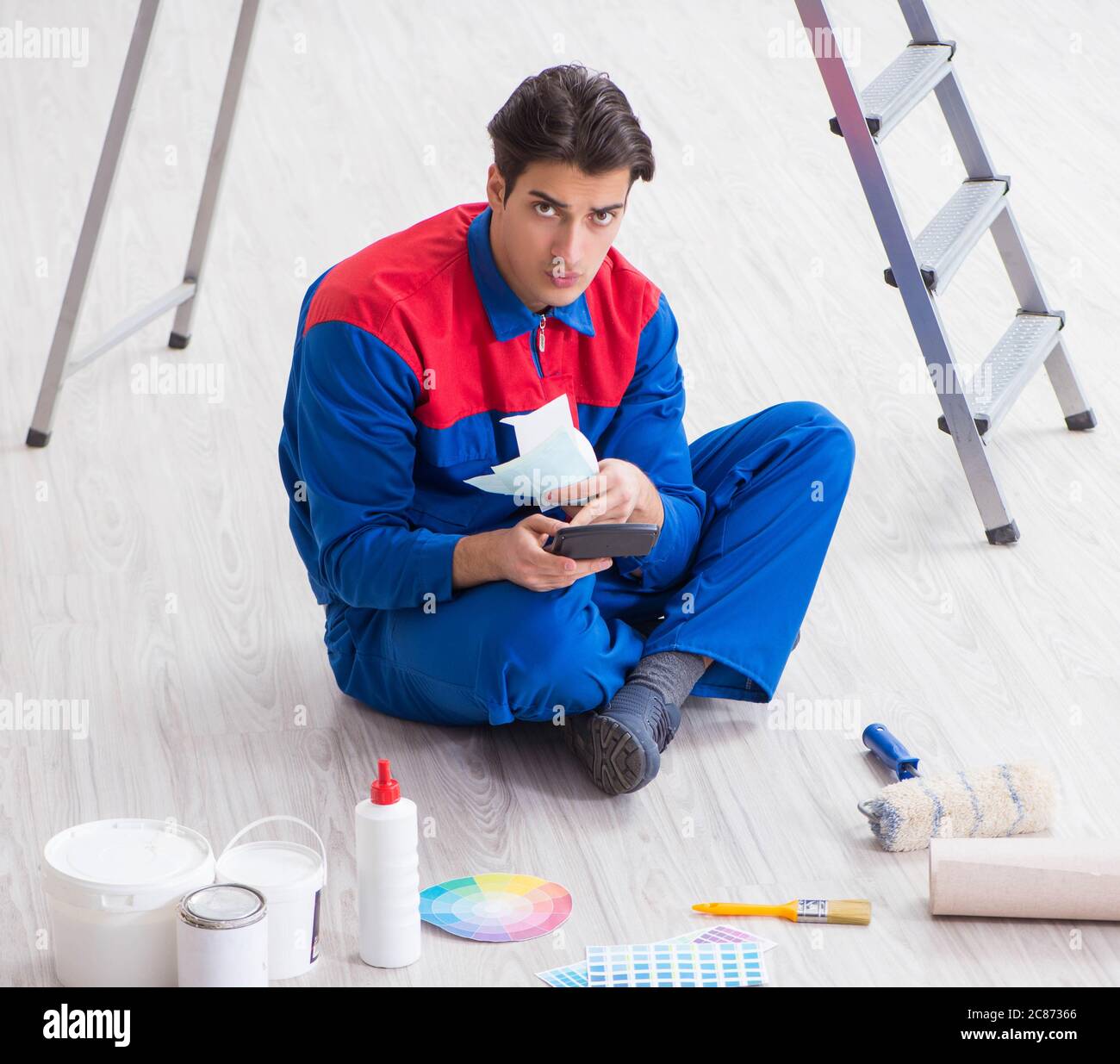 Young painter trying to match colours for painting hi-res stock ...