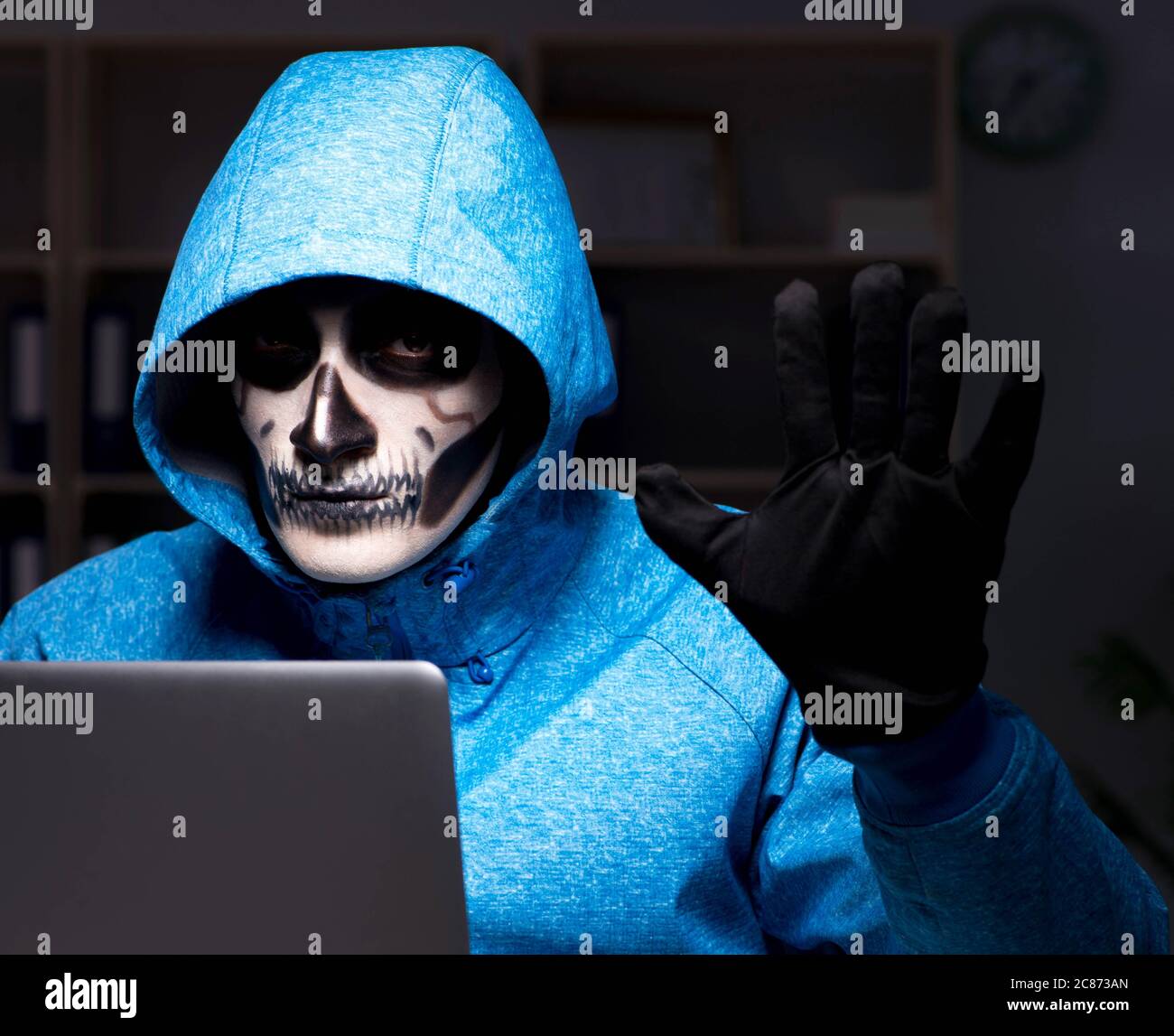 The scary hacker hacking security firewall late in office Stock Photo ...