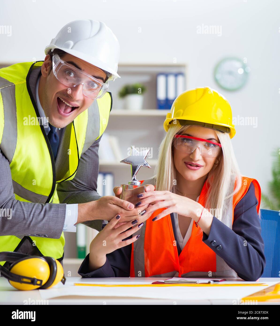 Construction workers having discussion in office before starting ...