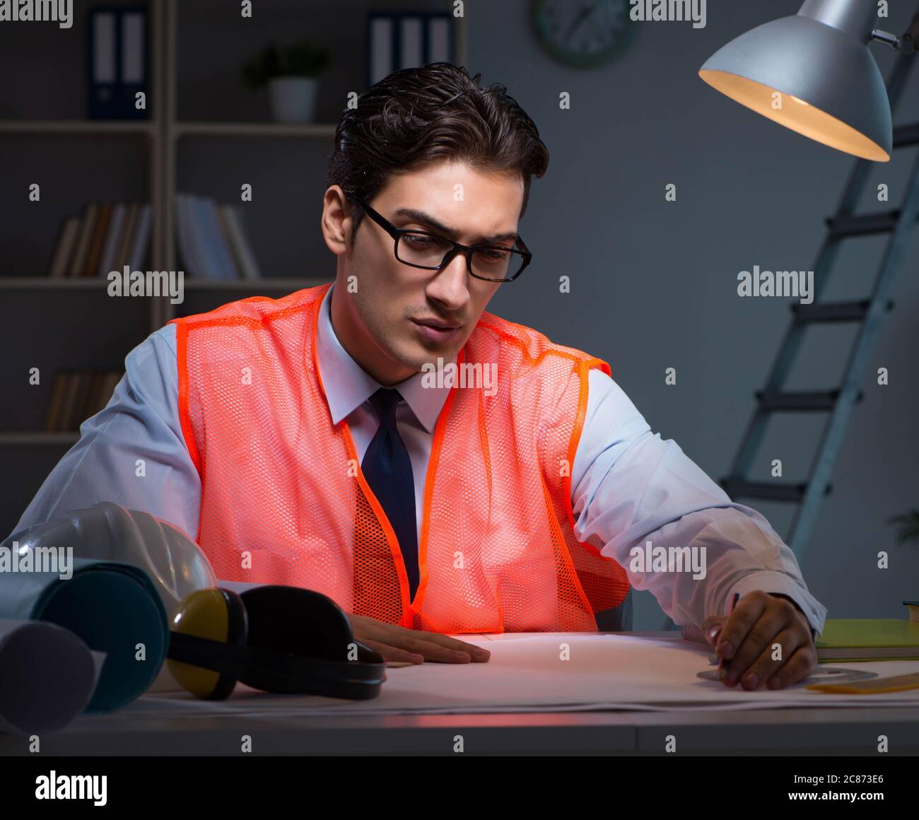 The construction architect working on drawings late at night Stock ...