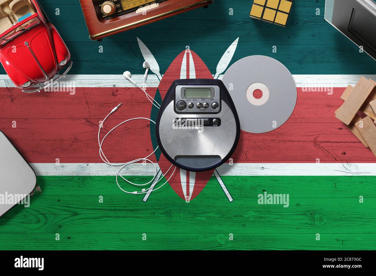 Kenya flag on wooden desk with retro digital media concept. National ...