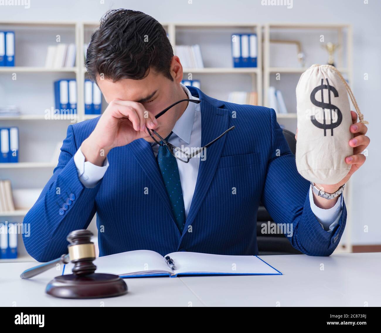 The judge in bribe concept with money Stock Photo - Alamy