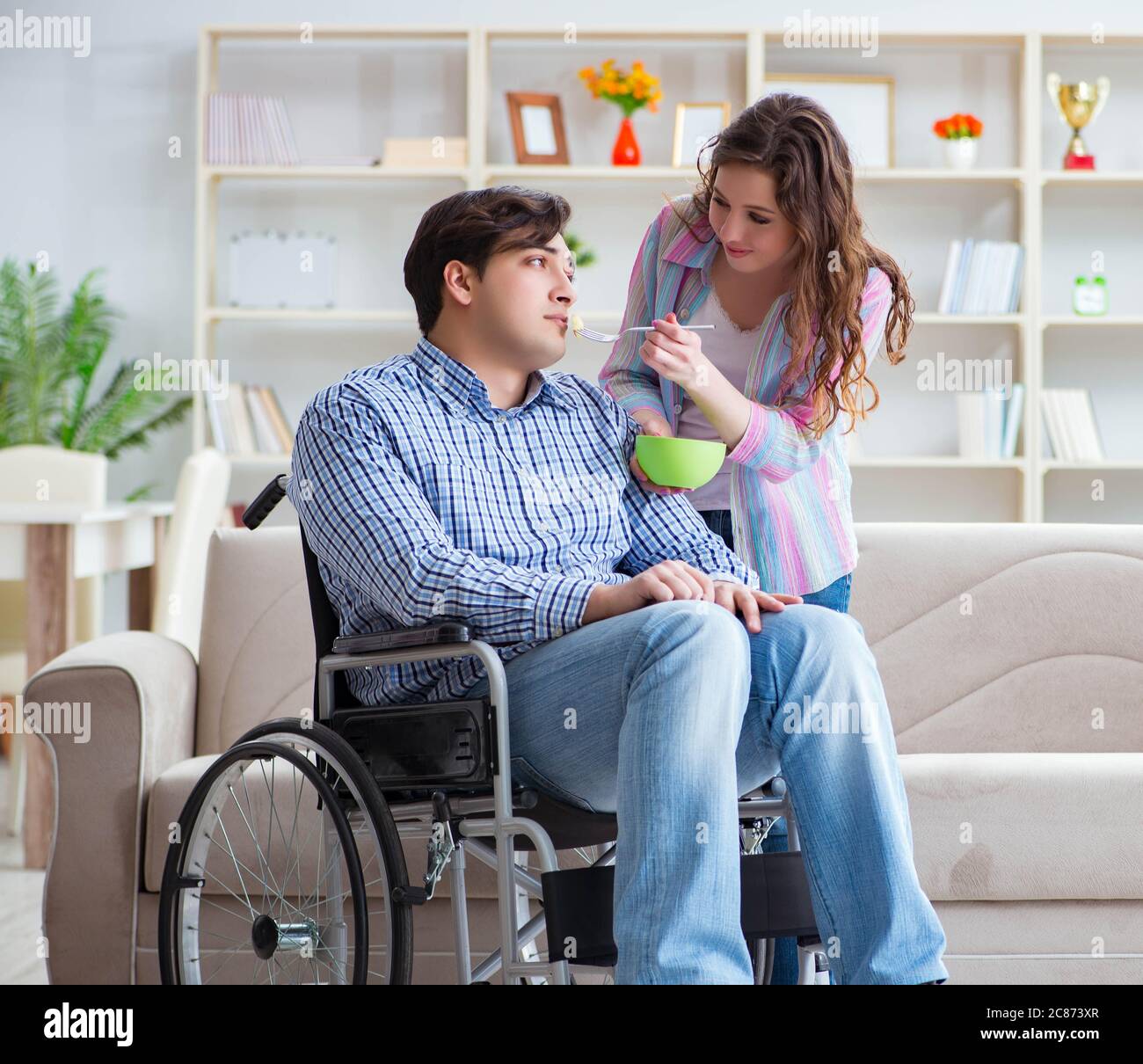 The young family taking care of each other Stock Photo - Alamy