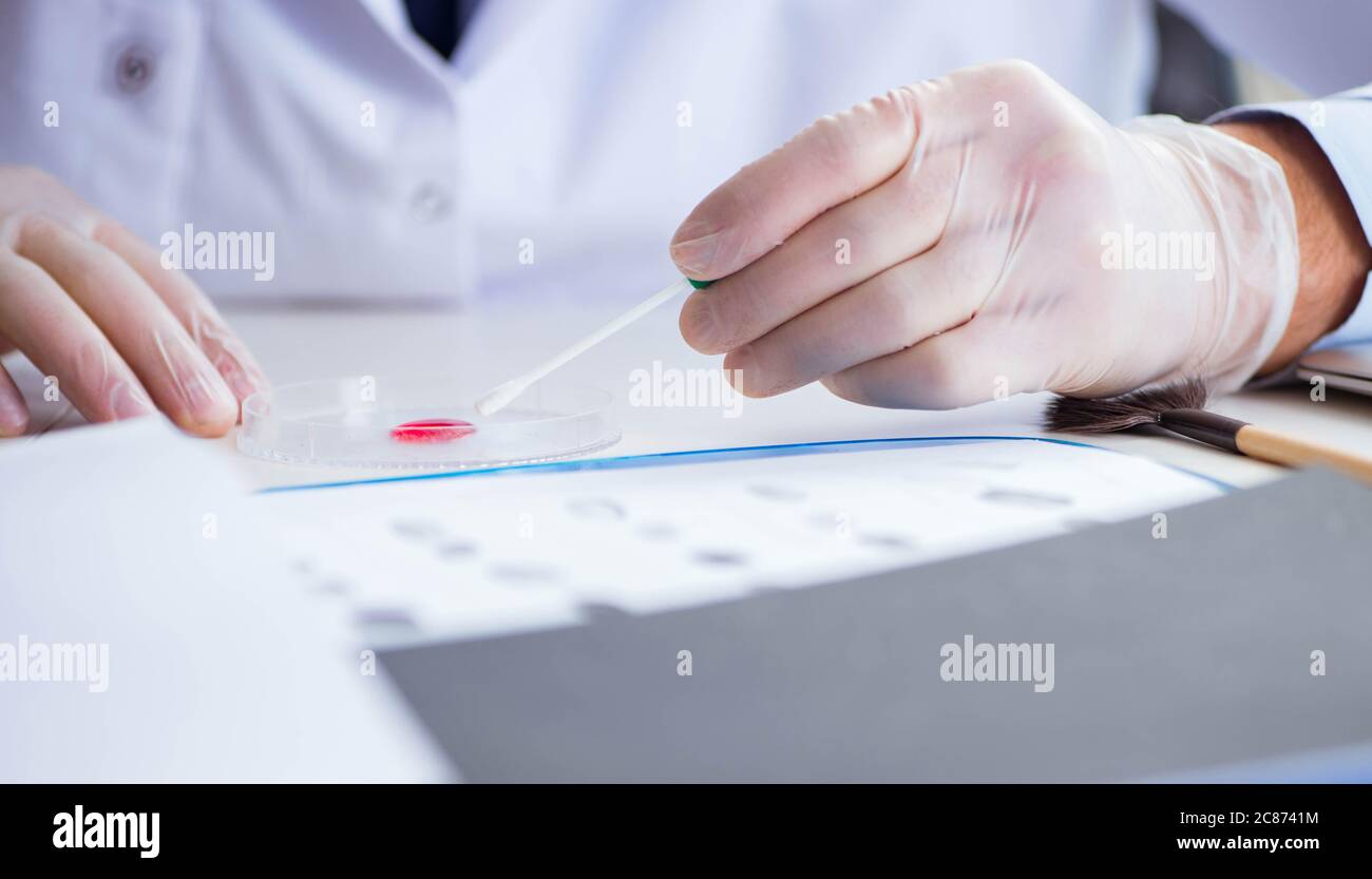 The drug synthesis lab experimentnig with pills Stock Photo - Alamy