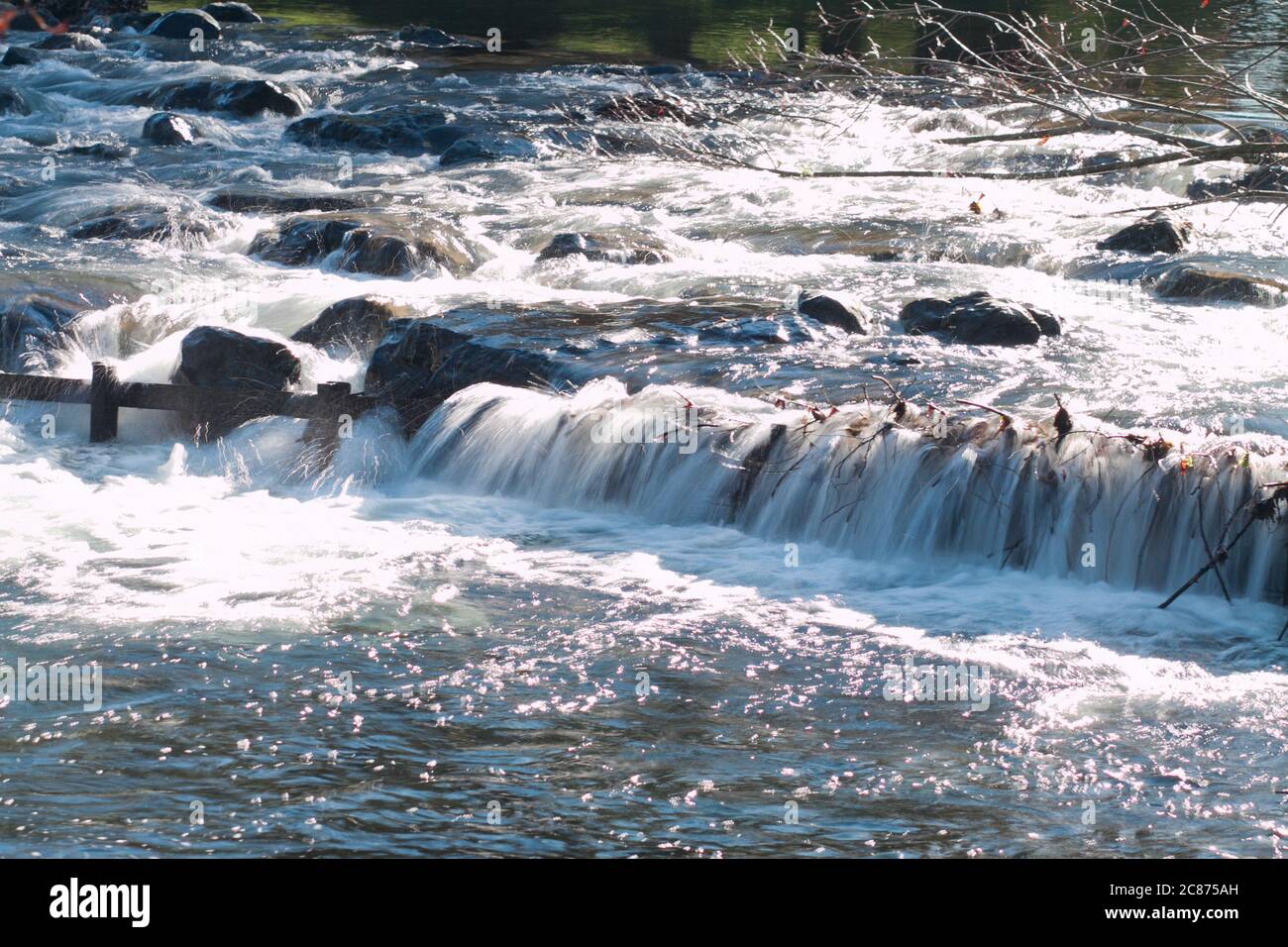 Powerful cascade of flowing water in the river Stock Photo - Alamy