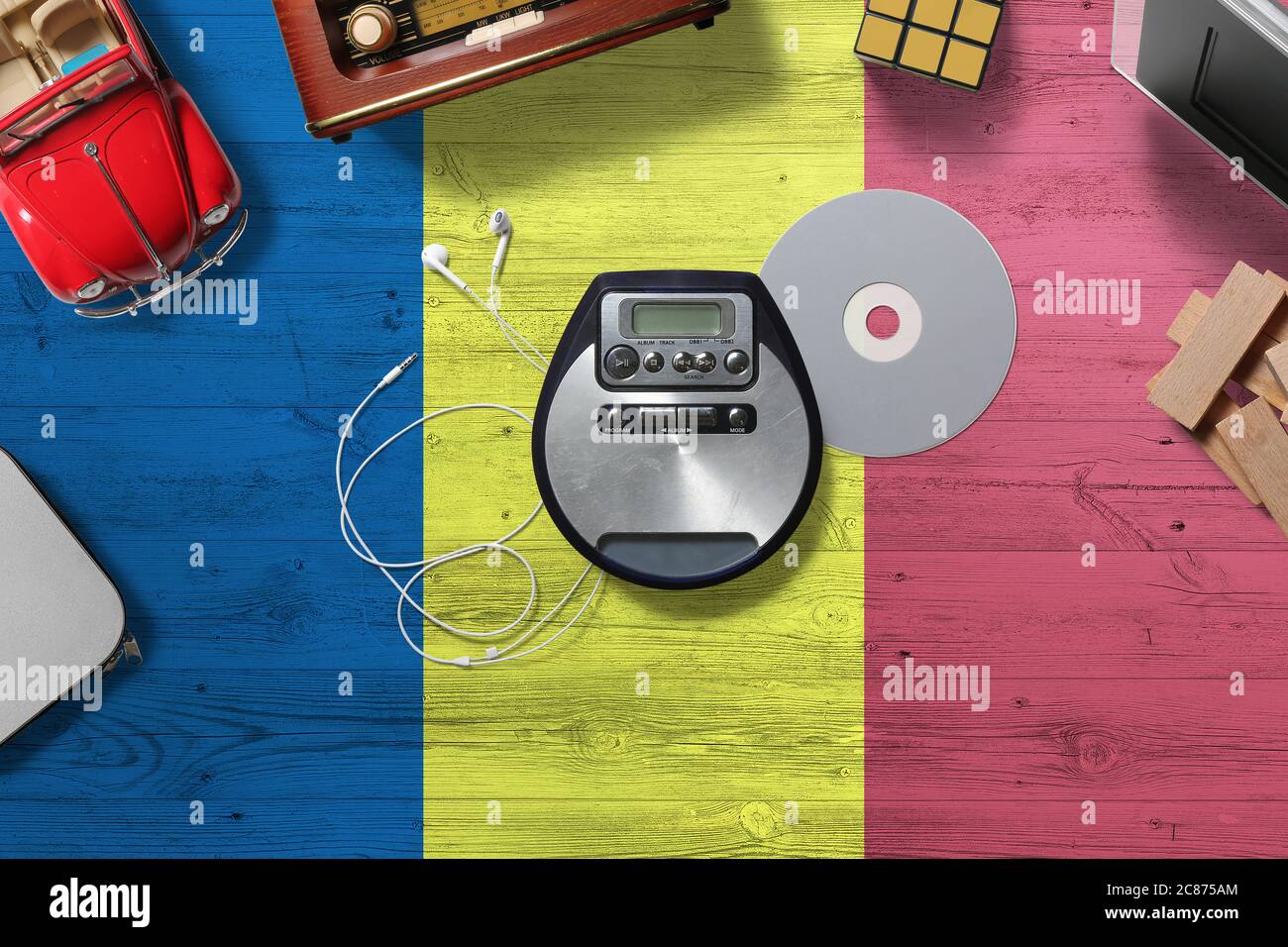 Romania flag on wooden desk with retro digital media concept. National ...