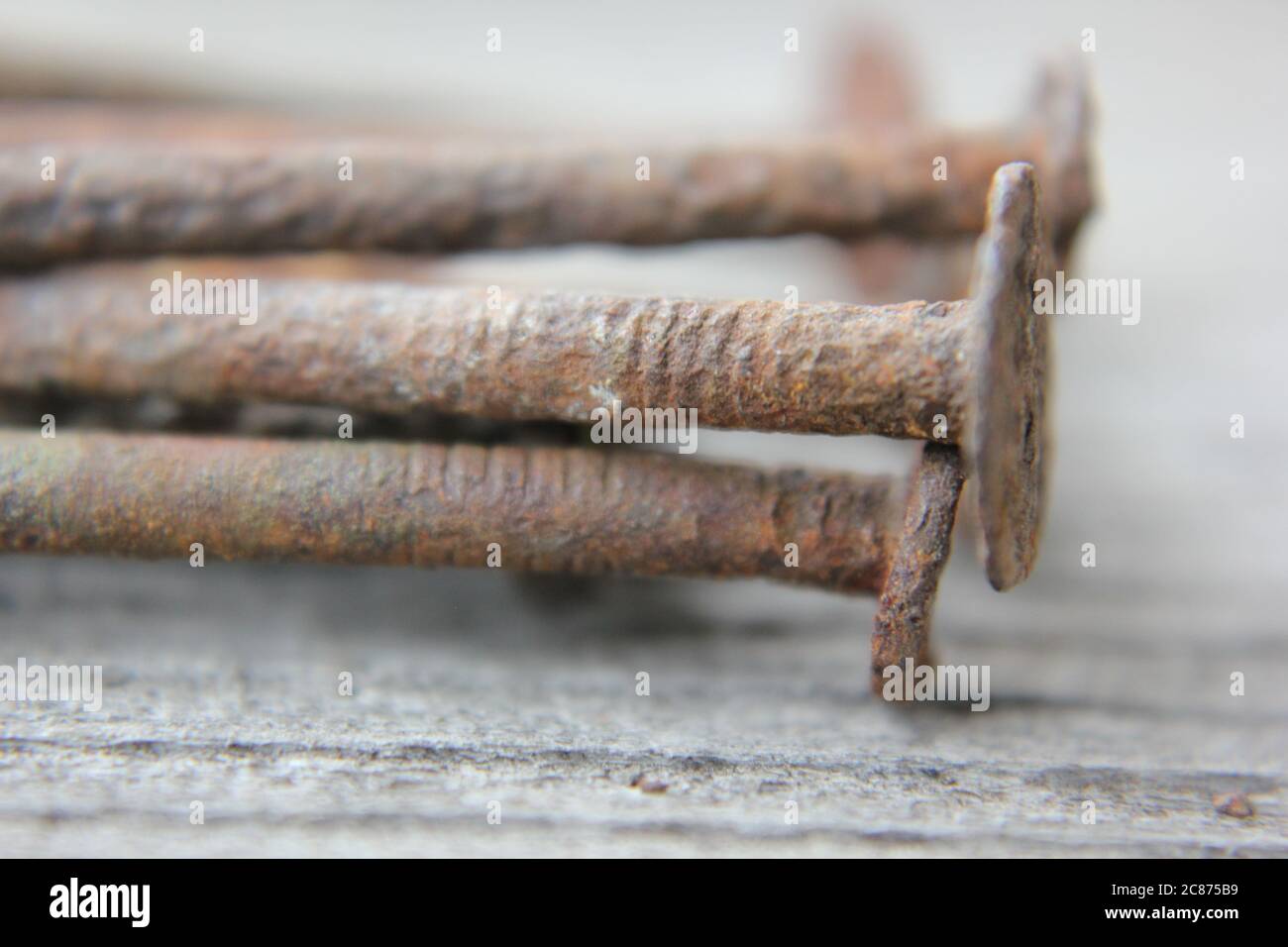 A pile of worn, rusted and out of date iron construction nails Stock ...