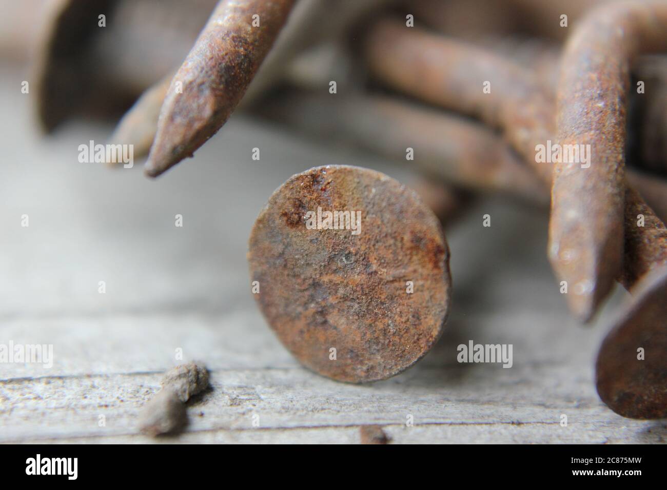 A pile of worn, rusted and out of date iron construction nails Stock ...