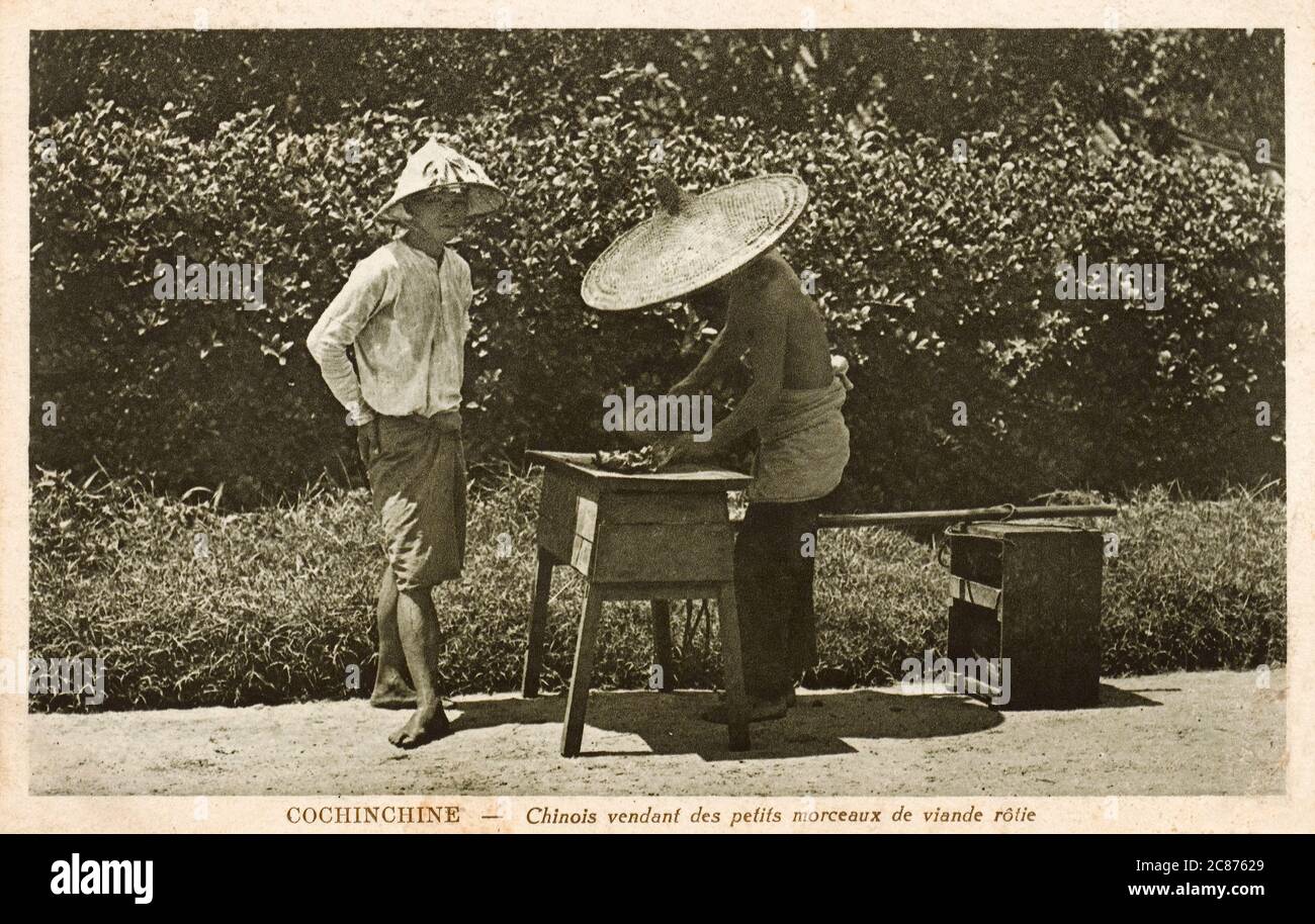 Vietnam - Chinese man selling small pieces of roasted meat Stock Photo ...