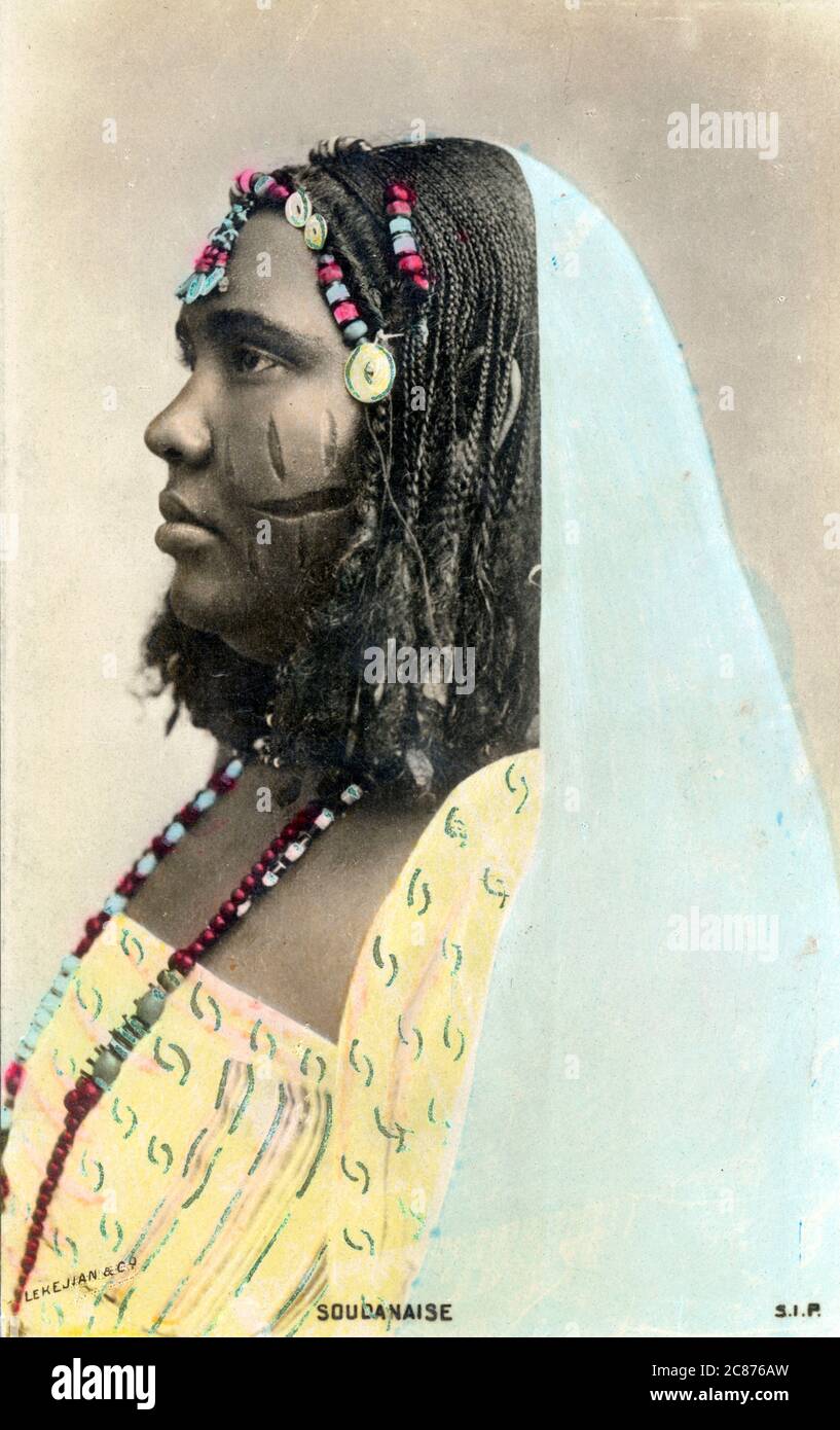 Sudanese woman showing traditional facial scarification and elegantly ...
