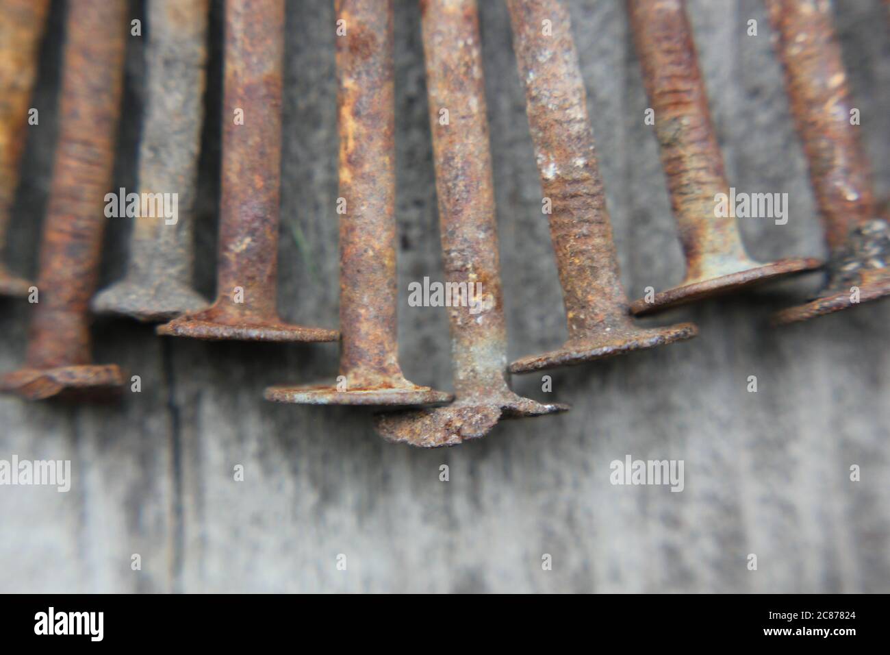 A pile of worn, rusted and out of date iron construction nails Stock ...