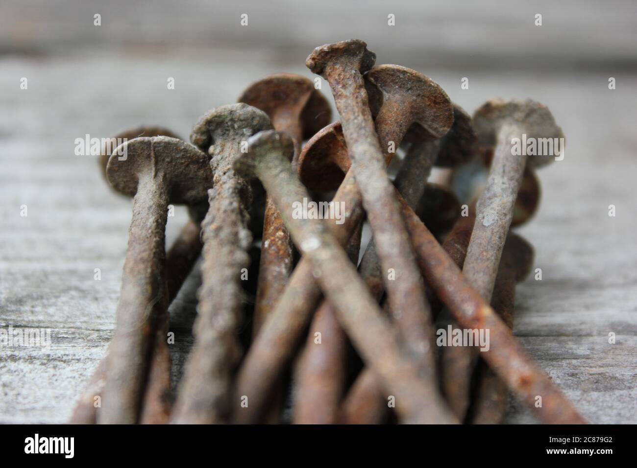 A pile of worn, rusted and out of date iron construction nails Stock ...
