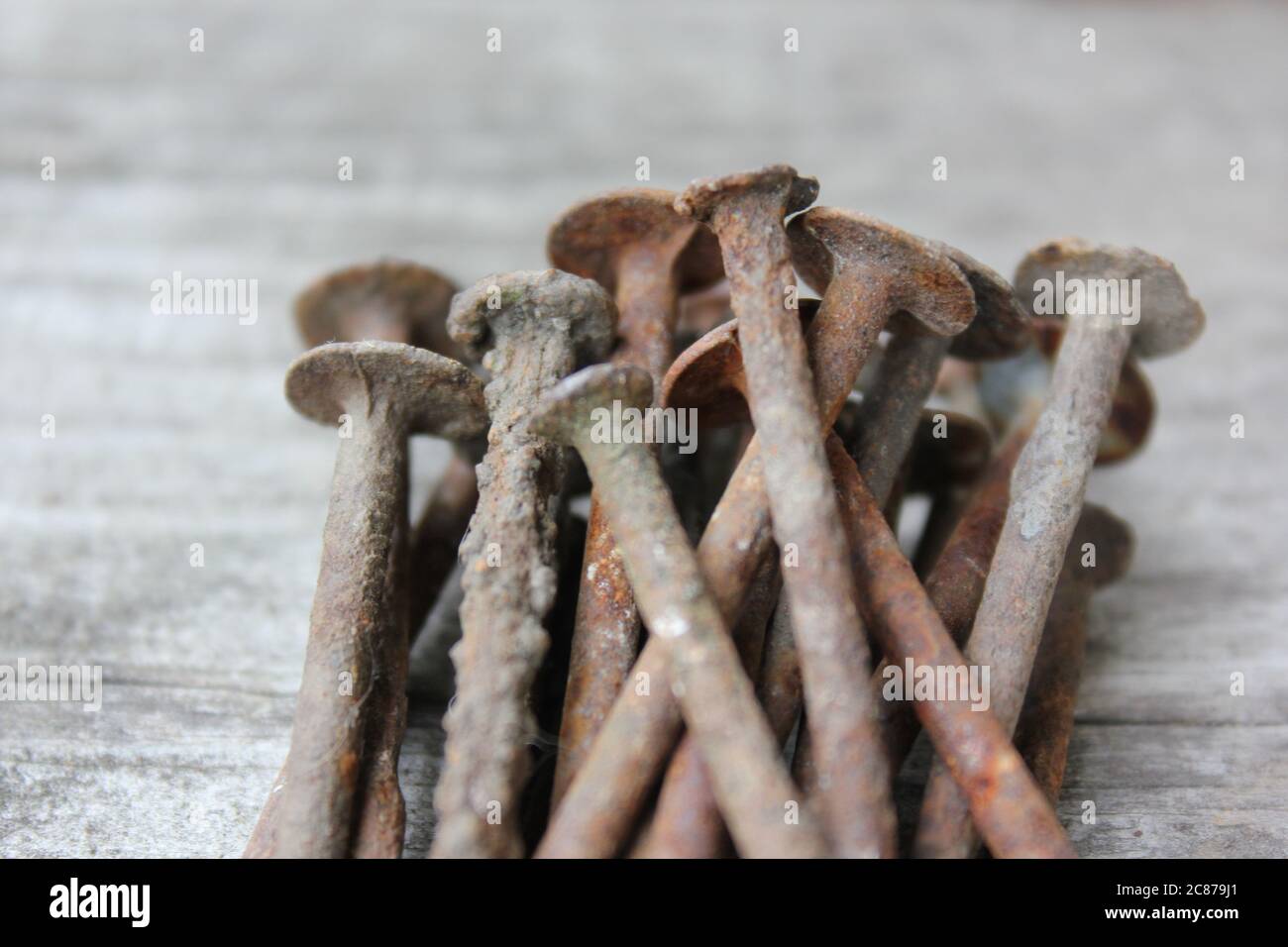 A pile of worn, rusted and out of date iron construction nails Stock ...