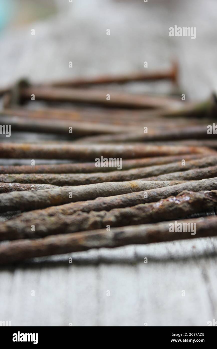 A pile of worn, rusted and out of date iron construction nails Stock ...