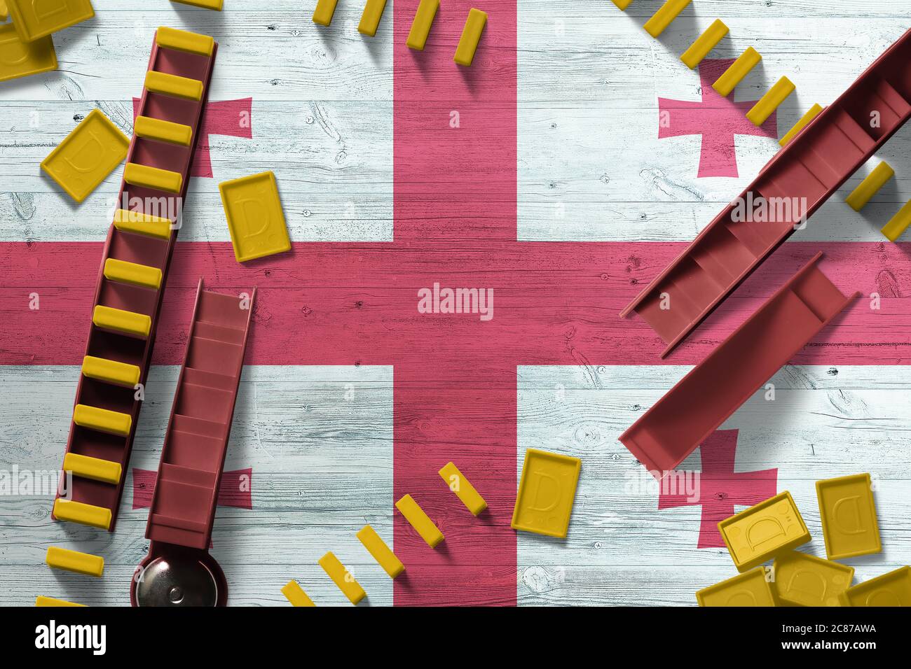 Georgia flag with national background with dominoes on wooden table ...