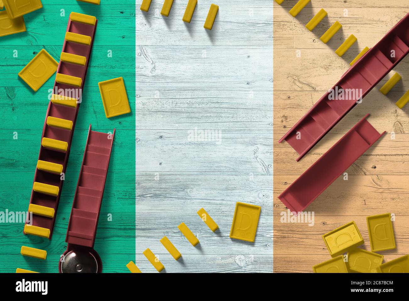 Ireland flag with national background with dominoes on wooden table ...