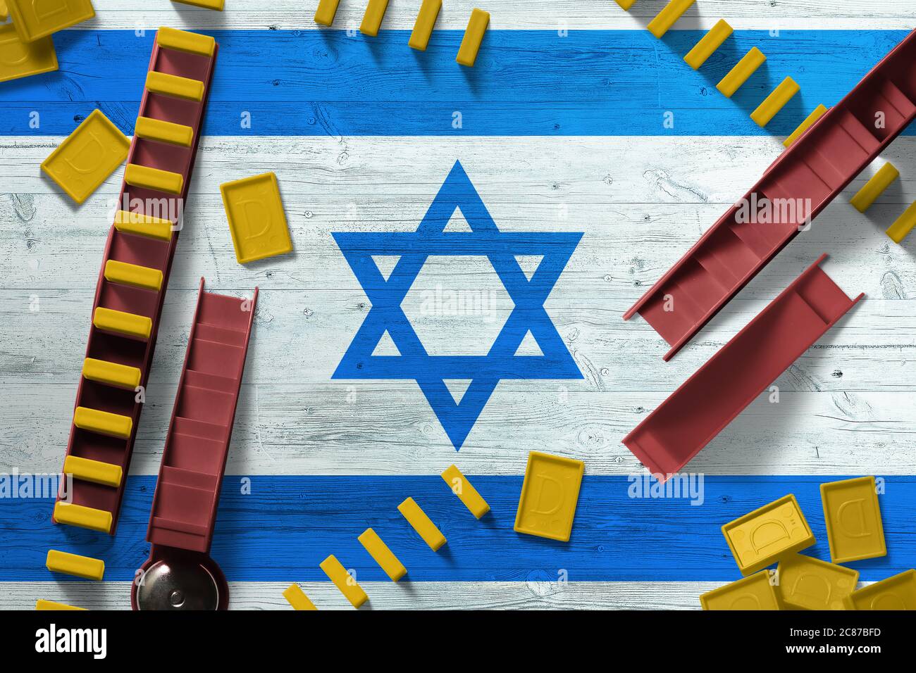 Israel flag with national background with dominoes on wooden table. Top ...