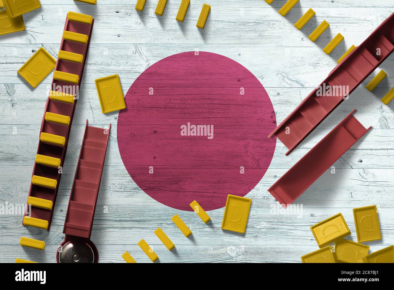 Japan flag with national background with dominoes on wooden table. Top ...