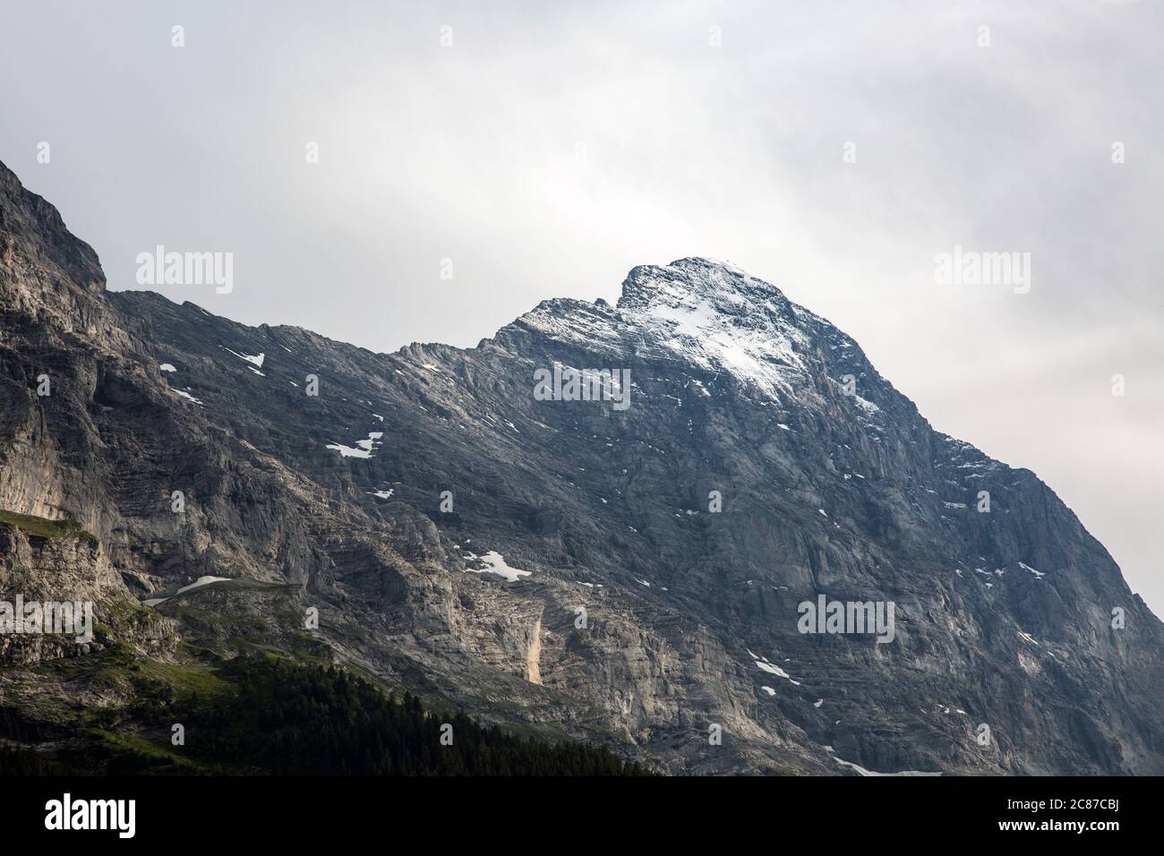 the North face of the Eiger mountain in a snow, Bernese Alps ...