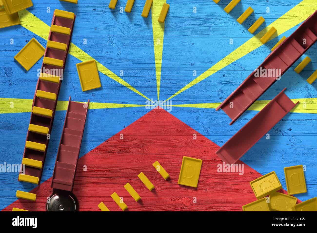 Reunion flag with national background with dominoes on wooden table ...