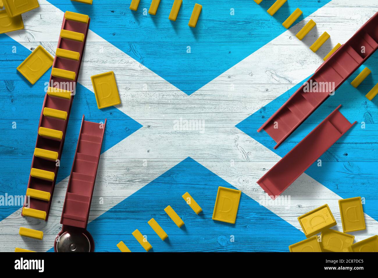 Scotland flag with national background with dominoes on wooden table ...