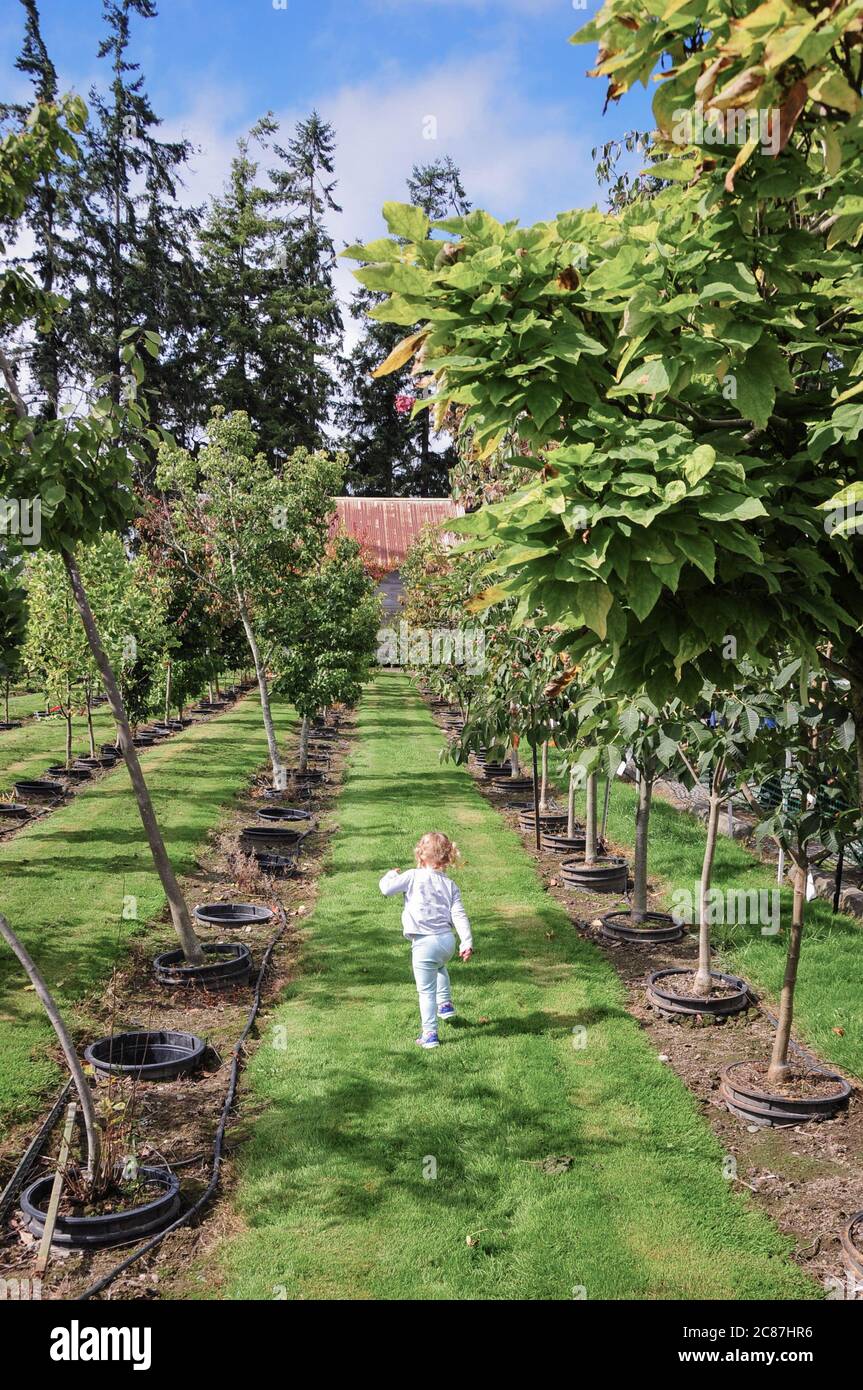 Child running away grass hi-res stock photography and images - Alamy