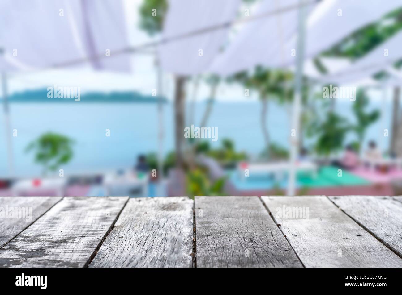 Selective focus of wooden table with blur coffee and restutant cafe ...