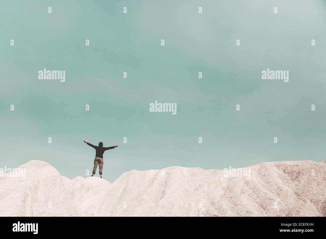 Man rise hands up to sky freedom concept with copyspace blue sky ...