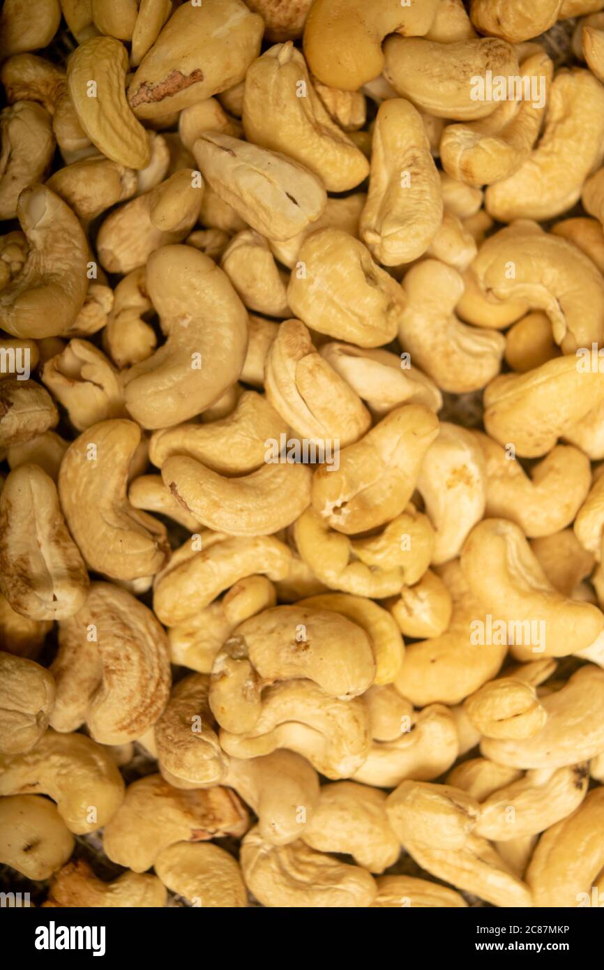 Cashew nuts scattered surface texture. Close up Stock Photo - Alamy