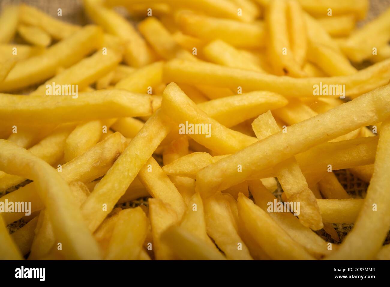 French fries scattered surface texture. Close up Stock Photo - Alamy