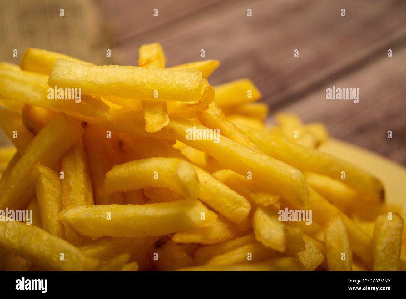 French fries on a homespun fabric with a rough texture. Close up Stock ...