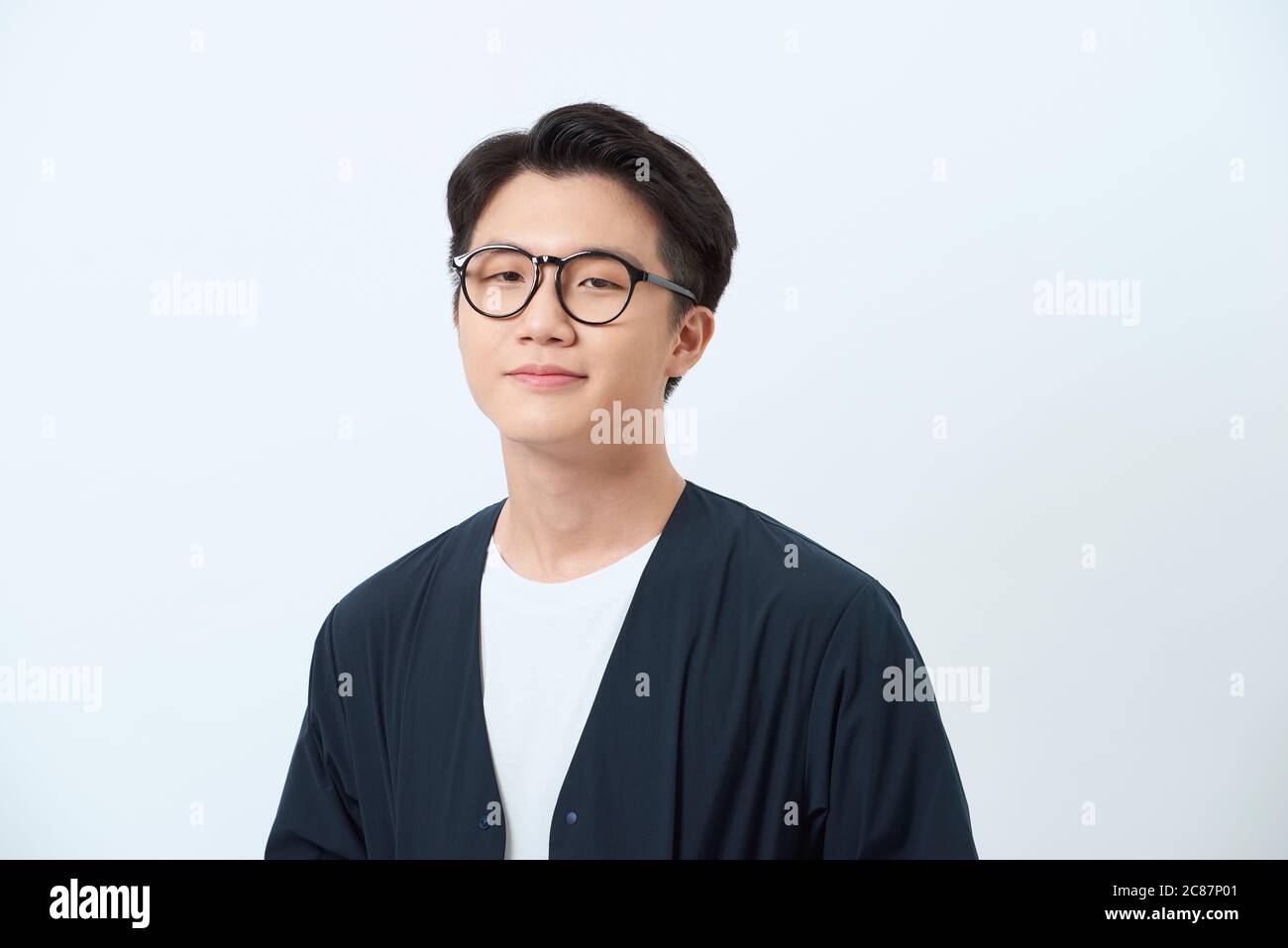 Portrait of friendly asian man wearing blue shirt, smiling Stock Photo ...