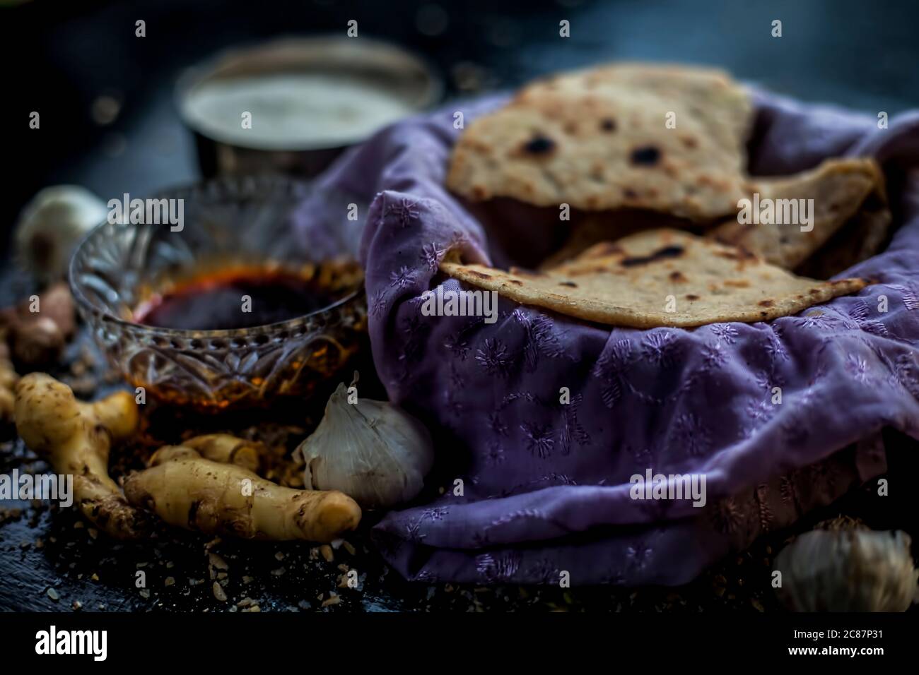 Shot of Gujarati breakfast consisting of round bread bhakri and lasun ...