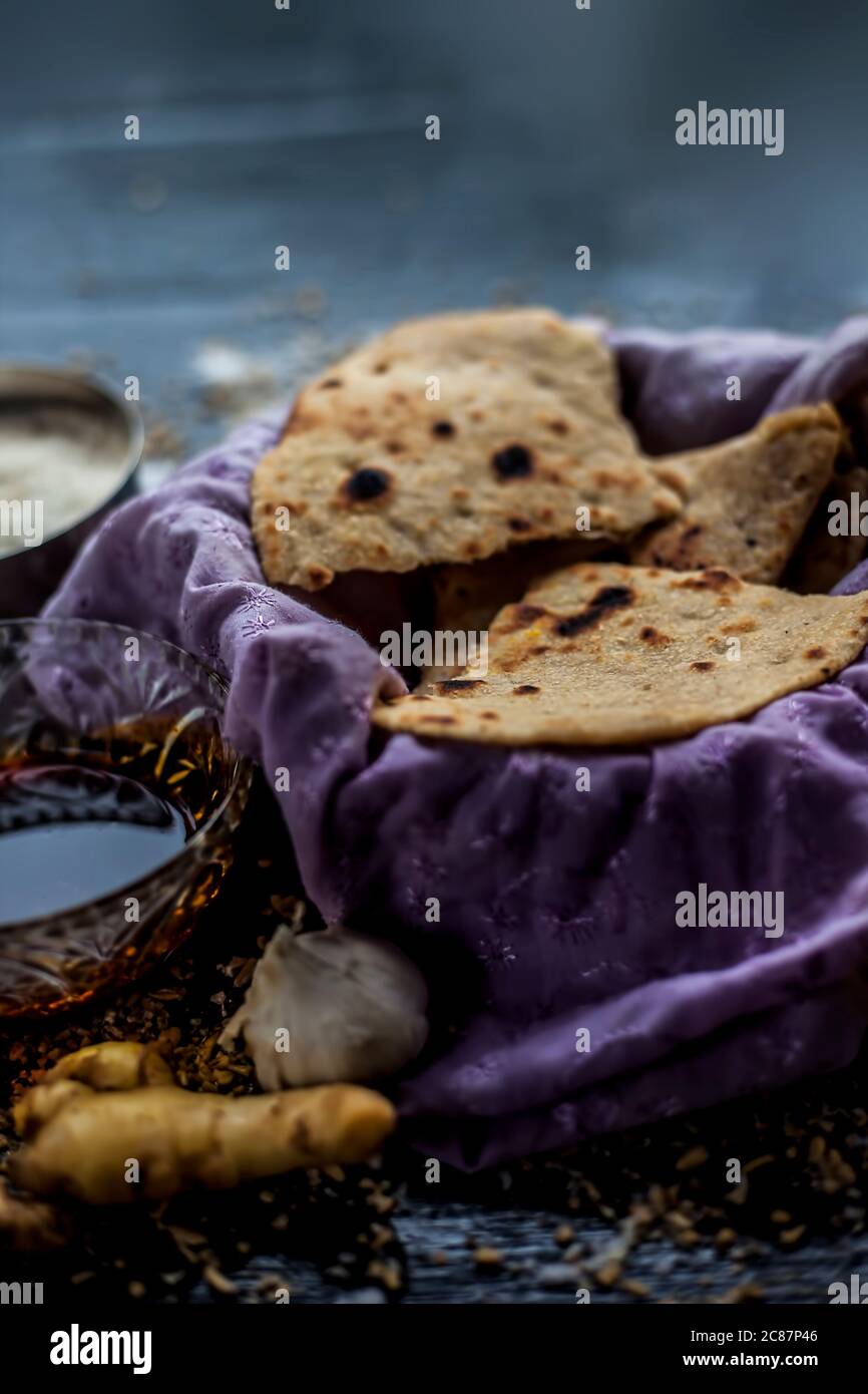 Shot of Gujarati breakfast consisting of round bread bhakri and lasun ...