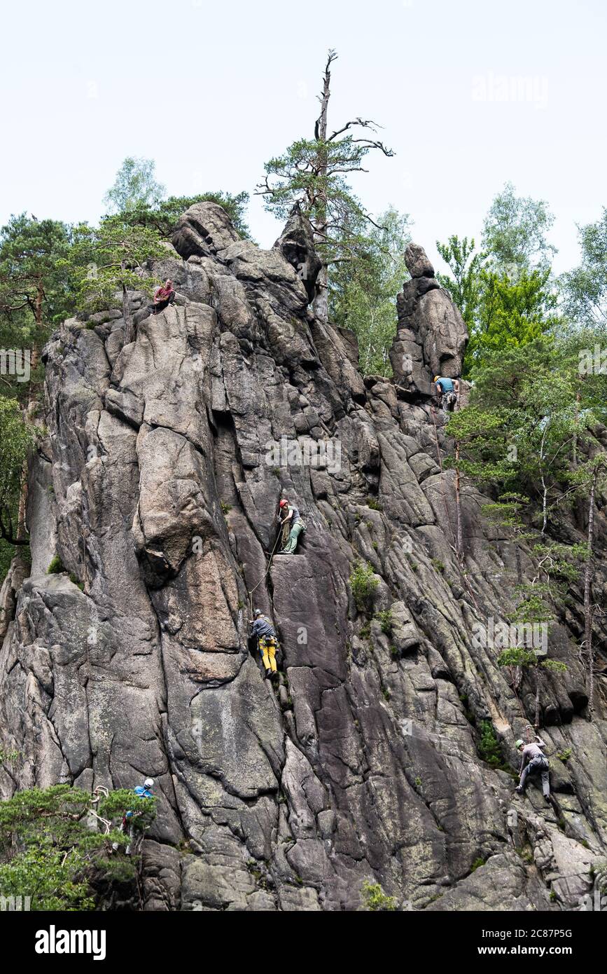 Oker, Germany. 11th July, 2020. Mountaineers climb up the granite rock ...