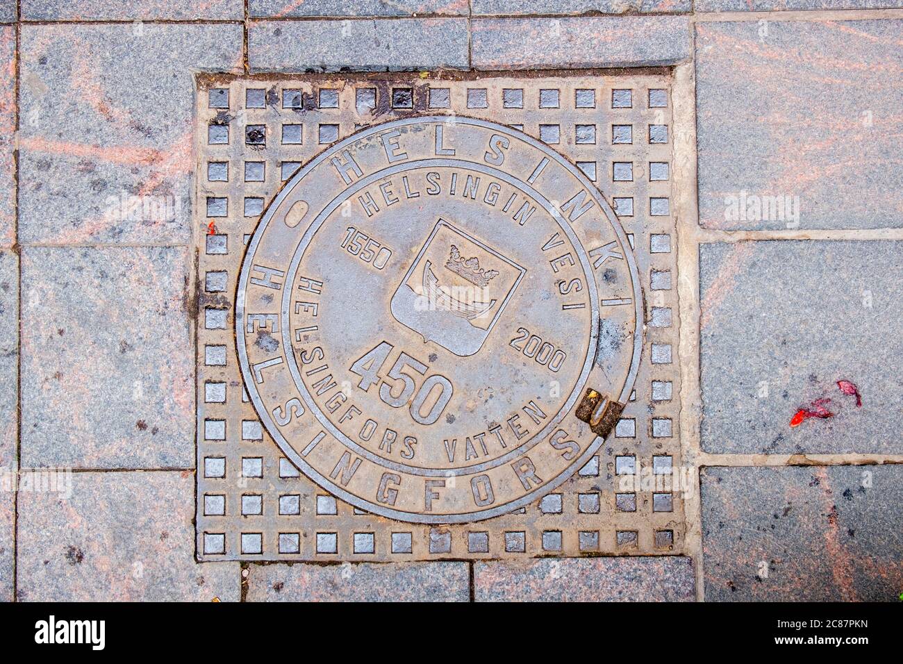 A view of a typical city manhole cover, featuring a viking ship and ...
