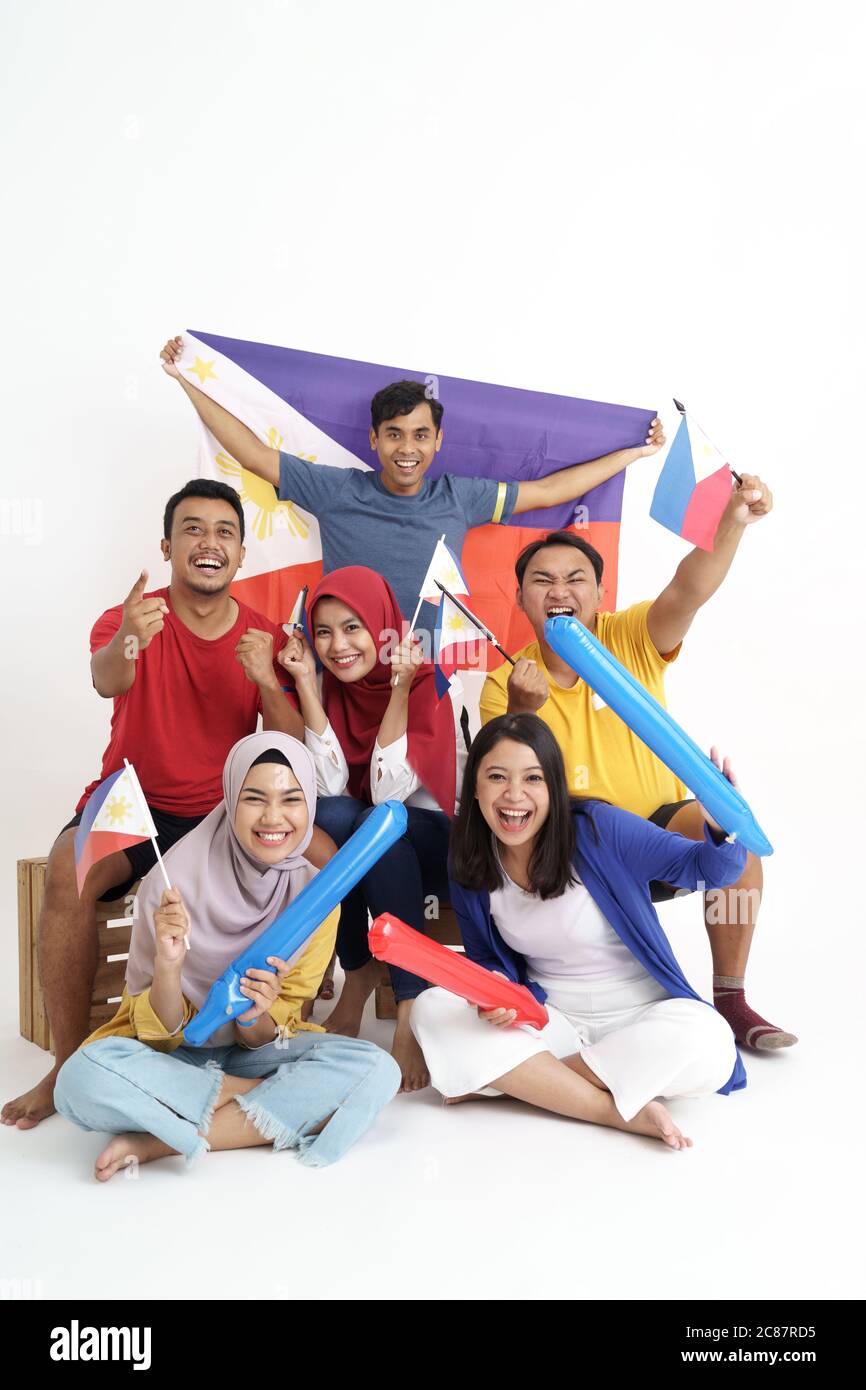filipino group of people holding philippines flag celebrating ...