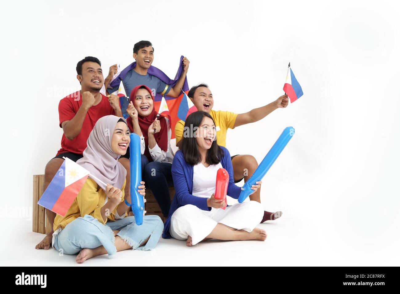 Filipino Group Of People Holding Philippines Flag Celebrating filipino-group-of-people-holding-philippines-flag-celebrating