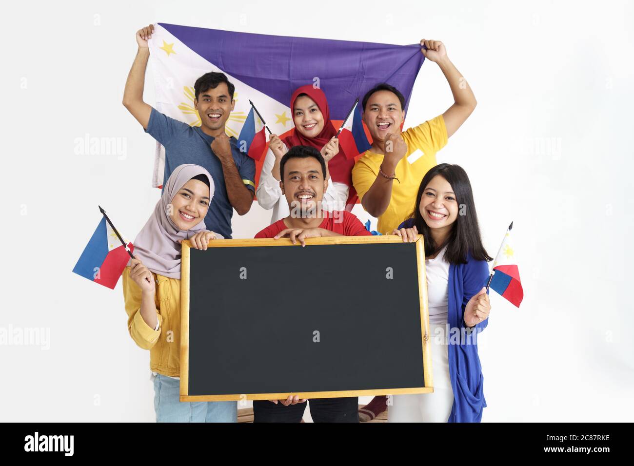 group of excited asian filipino supporter holding philippines flag and ...