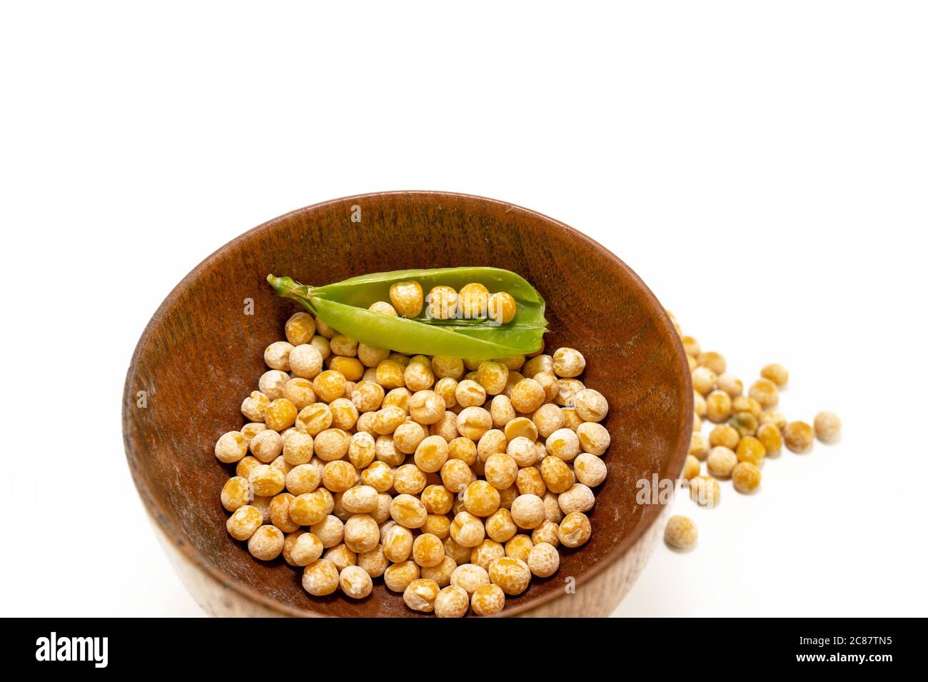 Dried peas in a rustic wooden bowl isolated on a white background Stock ...