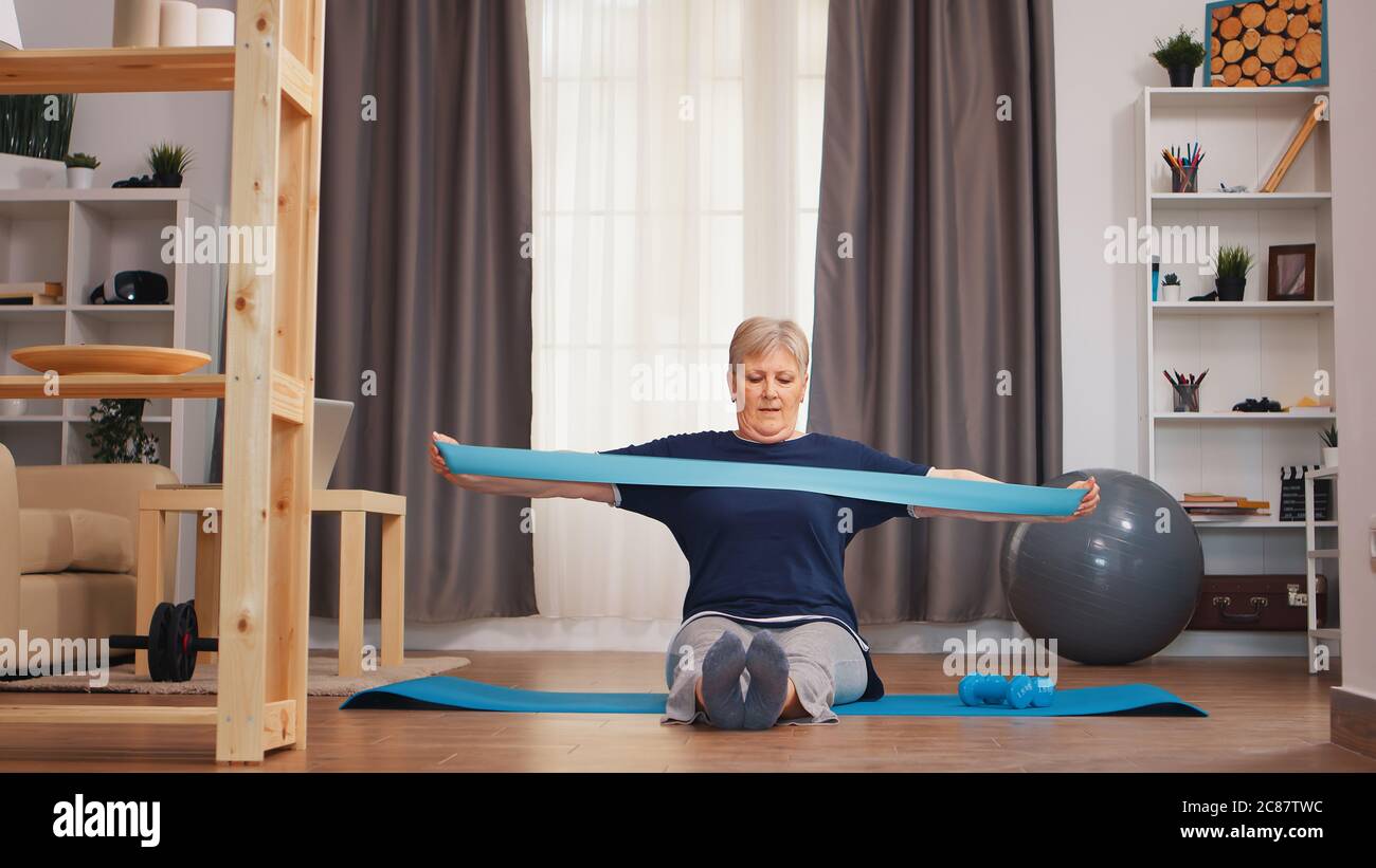 Old woman stretching hi-res stock photography and images - Alamy