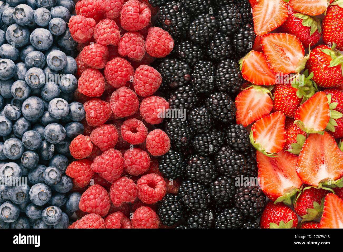 Berries overhead closeup colorful assorted mix of strawberry, blueberry ...
