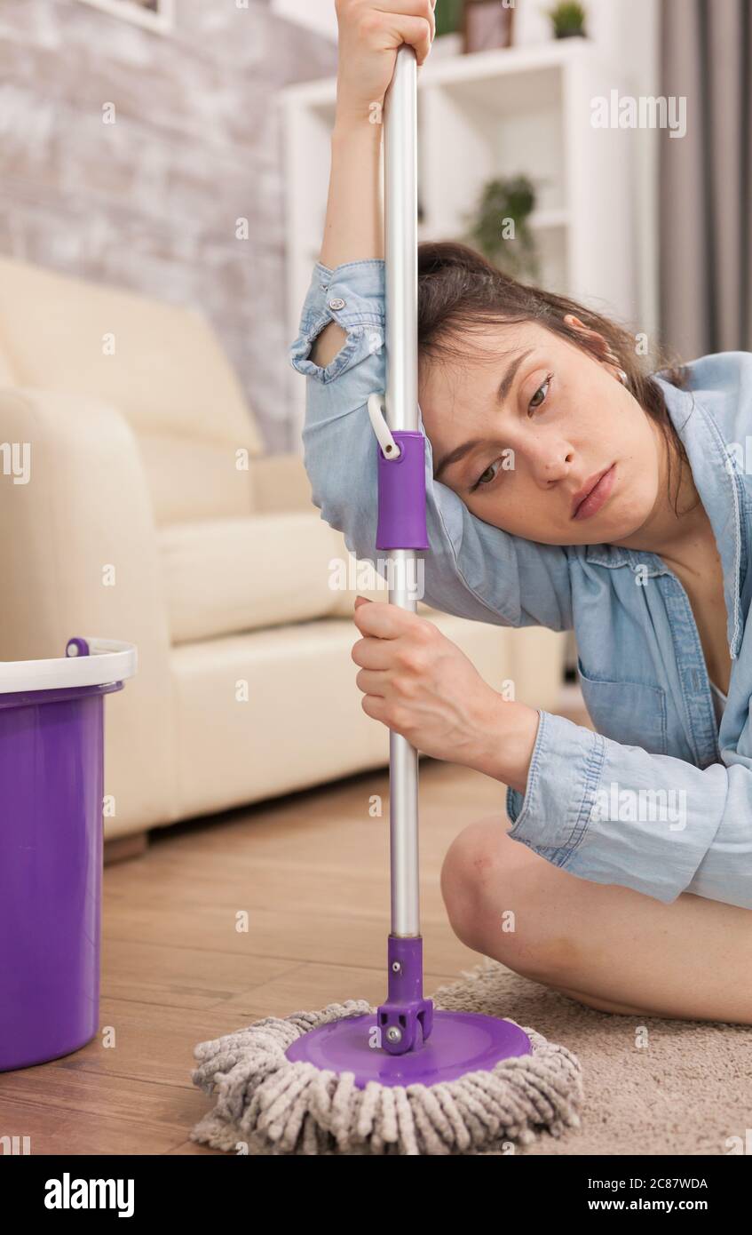Tired housewife resting after cleaning the house Stock Photo - Alamy
