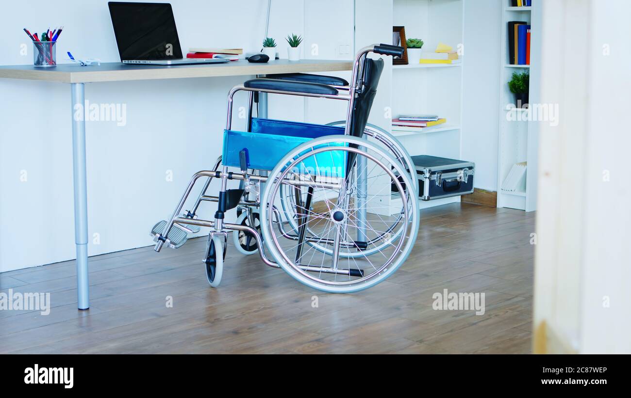Revealing shot of wheelchair in empty room for people with disabilities ...