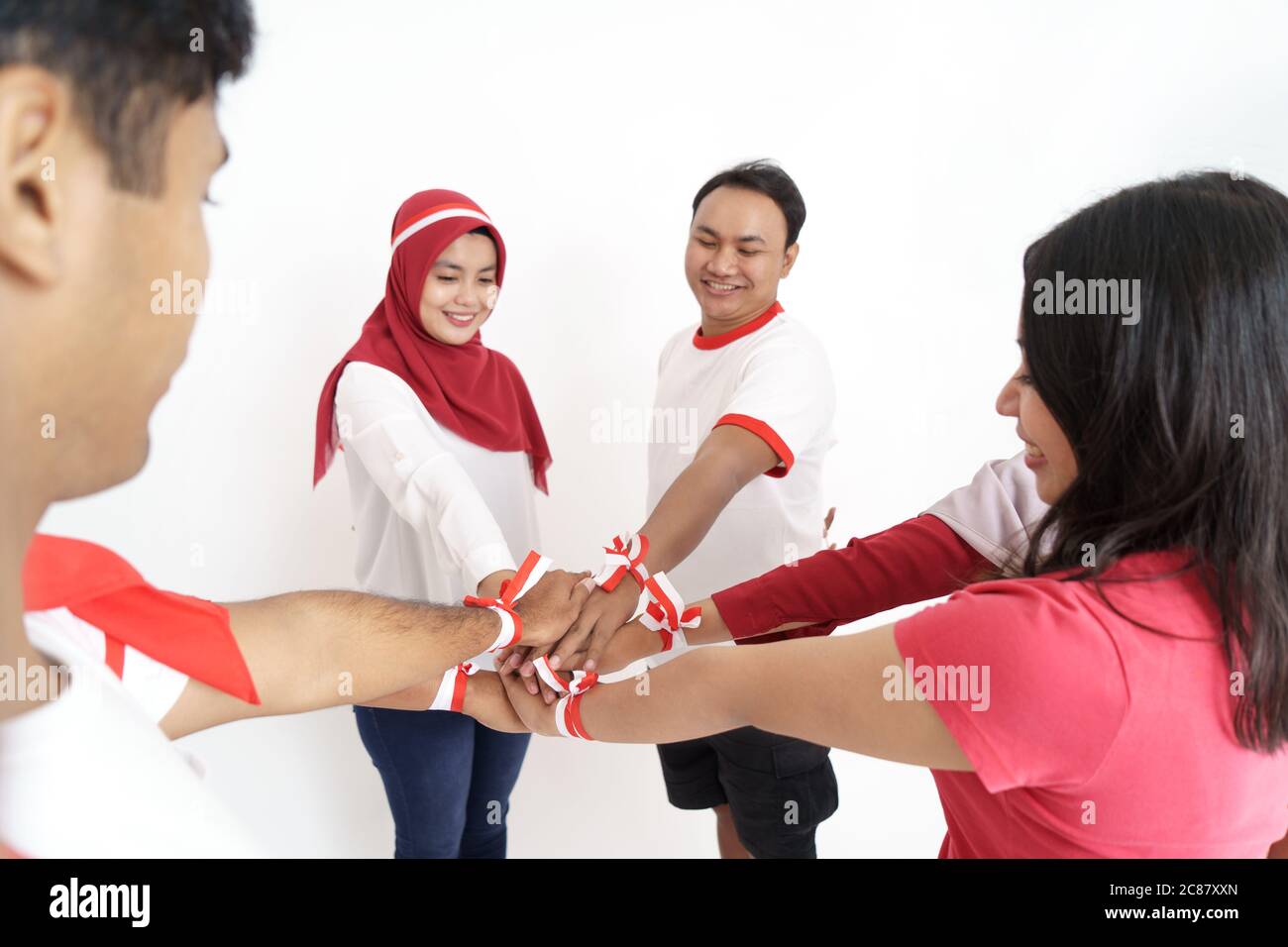 happy indonesian people putting their hand together on independence day ...