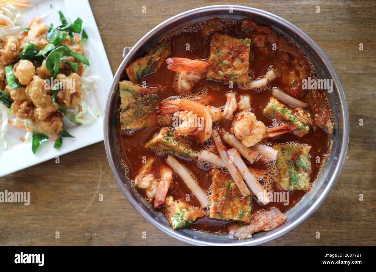 Thai sour curry soup made by tamarind with vegetable omelette, lotus ...