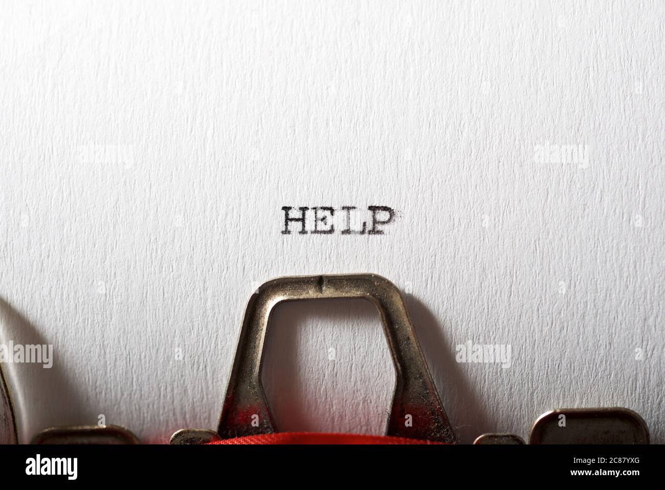 Help word written with a typewriter Stock Photo - Alamy